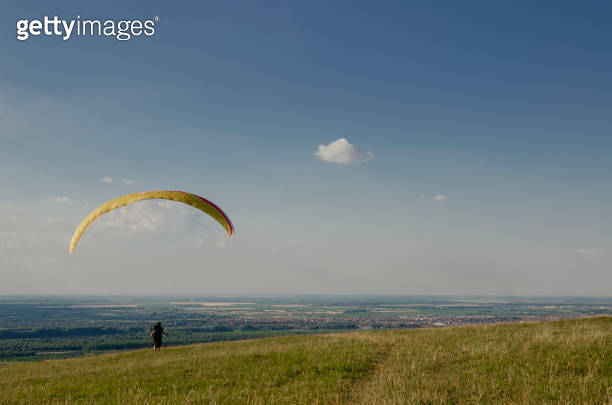 Man running high speed on field in nature ready to takeoff with ...