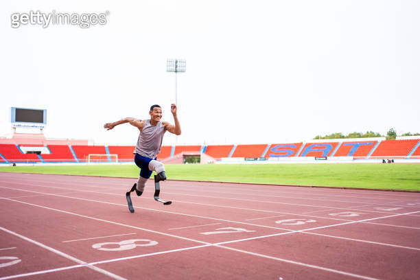 Asian para-athletes disabled with prosthetic blades running at stadium ...