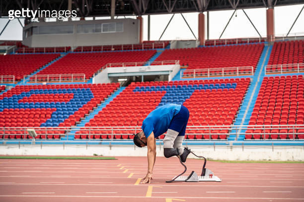 Asian para-athletes disabled with prosthetic blades running at stadium ...