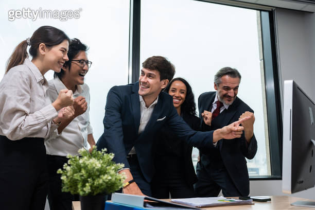Group of multi-Ethnic businessman and businesswoman clapping together ...