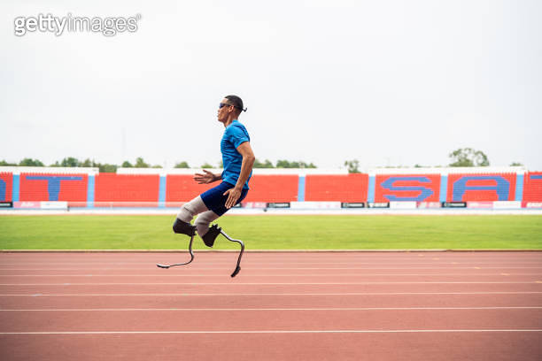 Asian para-athletes disabled with prosthetic blades running at stadium ...