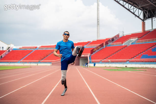 Portrait of Asian para-athletes disabled with prosthetic in stadium ...