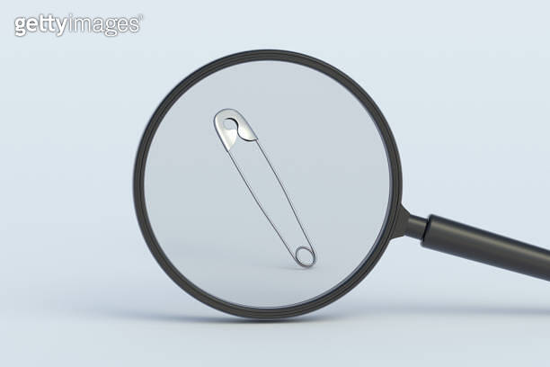 Metallic safety pin behind magnifying glass. 3d render 이미지 (2136530010 ...