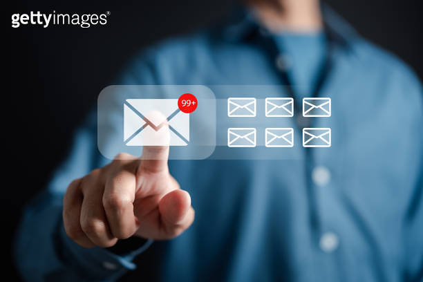 Businessman sending email by laptop computer to customer, business ...