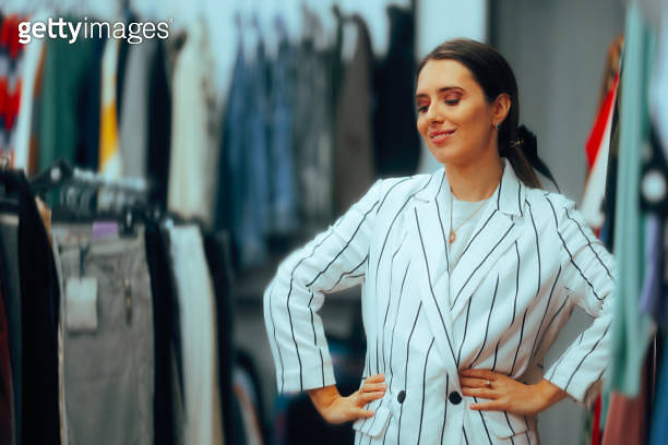Happy Store Manager Standing Elegant in a Clothing Store 이미지 ...