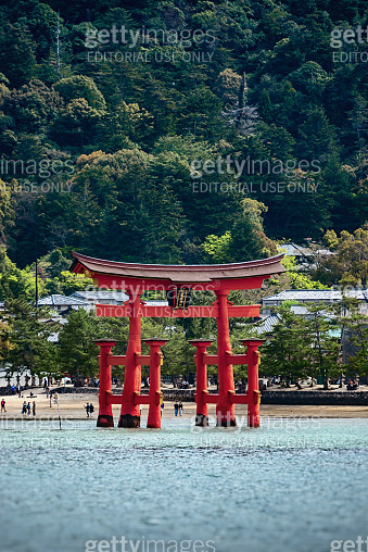 Torii of the Itsukushima Shrine seen from the ferry - Miyajima, Japan ...