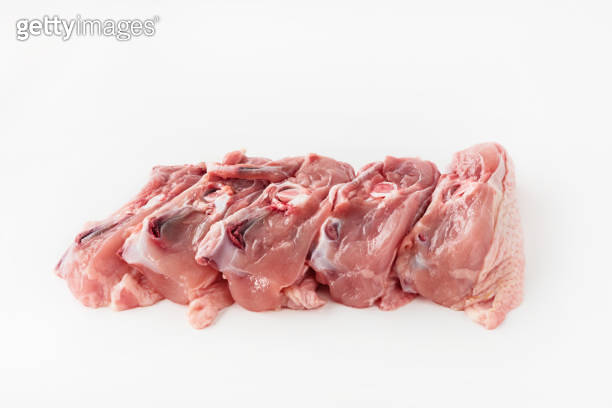 Chunks of chicken bones and meat for roast on a white isolated ...