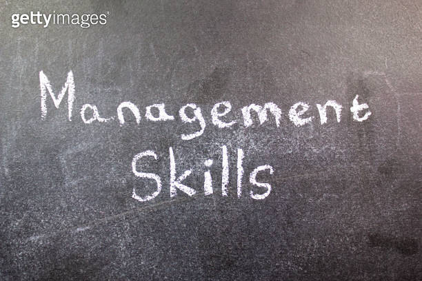 MANAGEMENT SKILLS written in chalk on a blackboard. Management skills ...