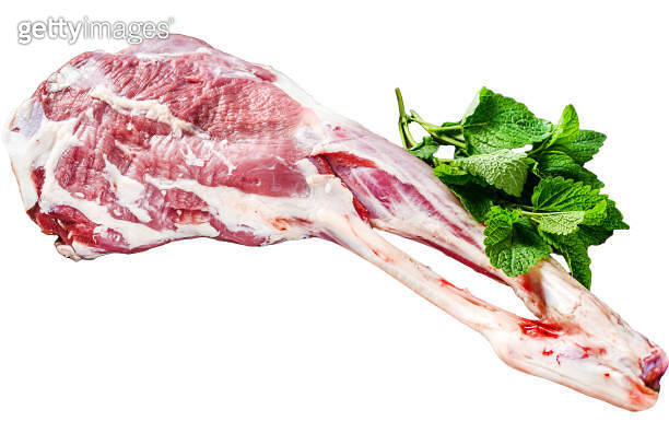 Whole raw goat leg with herbs and spices. Farm meat. Isolated on white ...