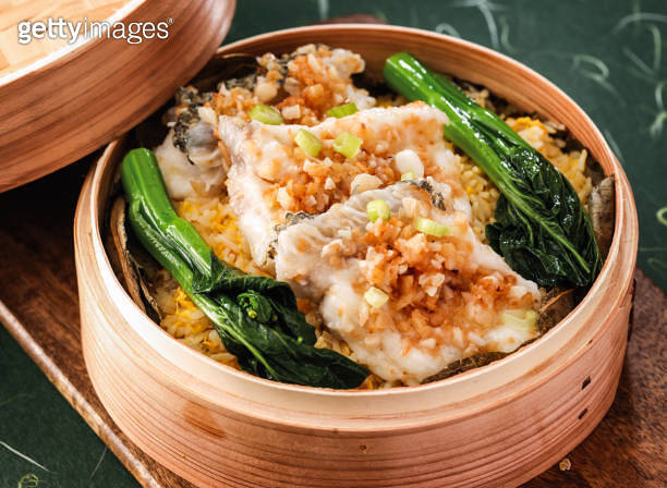Garlic and Dragonite Steamed Rice served in dish isolated on background ...