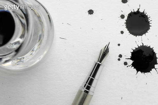 Stylish fountain pen and inkwell on paper with blots of ink, flat lay ...