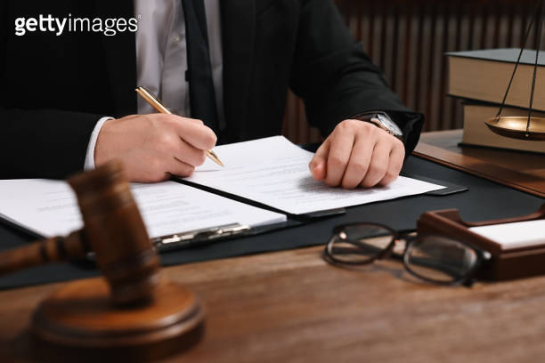 Lawyer working with documents at wooden table in office, closeup 이미지 ...