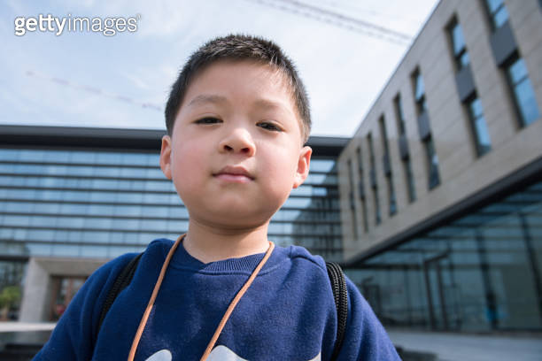 A cute Asian boy is staring at the camera 이미지 (2083574626) - 게티이미지뱅크