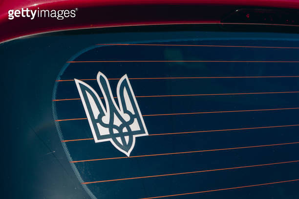 Ukrainian emblem on red car window. Coat of arm of Ukraine. Sticker of ...