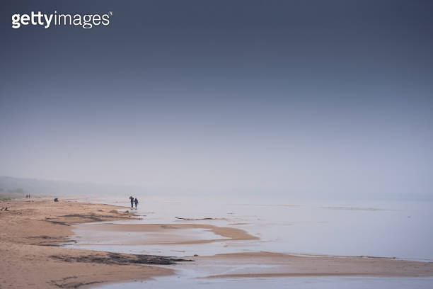 Panorama of the Garciems beach with unrecognizable people walking ...