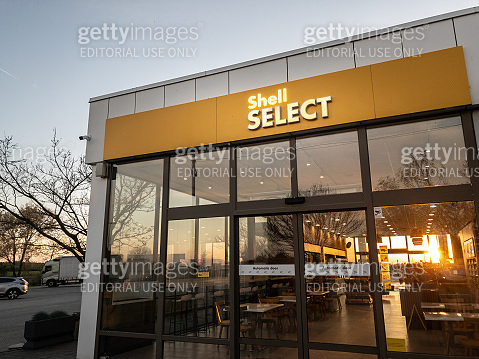 Logo of Shell select on their convenience store in a shell gas station ...