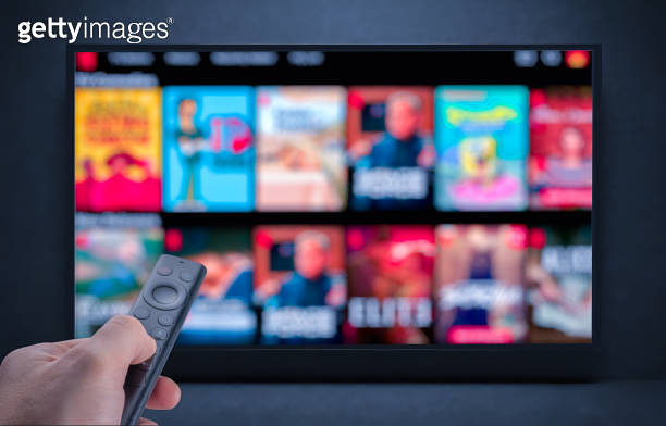 Tv online. Television streaming video. Male hand holding TV remote ...