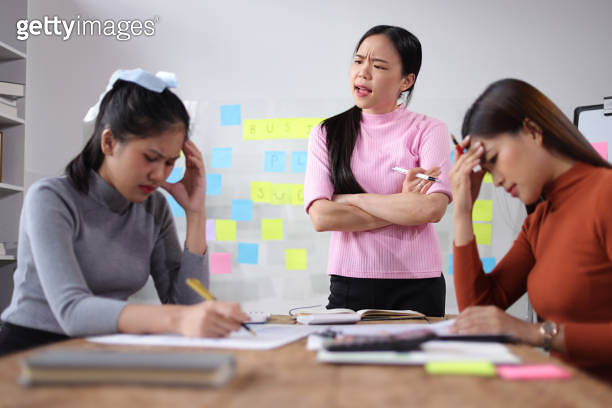 Stressed annoyed office employee manager having headache migraine at business meeting with his ...