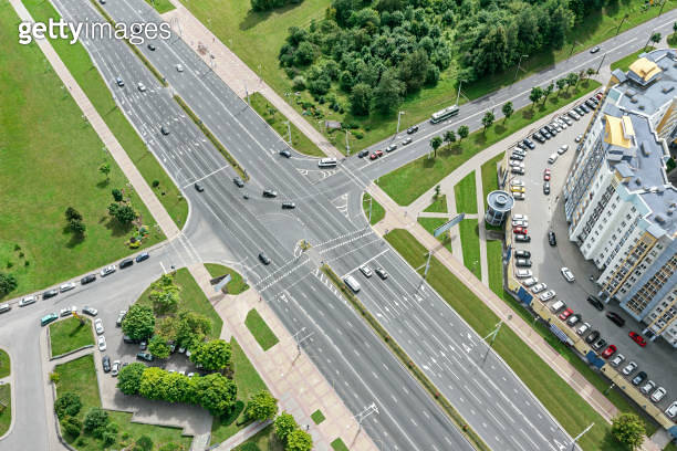 aerial view of intersection of the road with cars traffic in urban ...