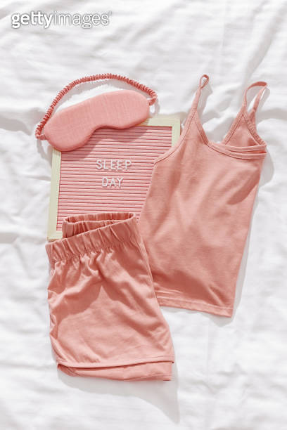 Sleep day holiday concept, Top view pink pajama and eye sleep mask on ...