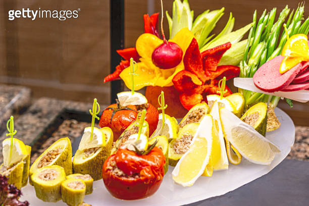 Delicious foods, fruits, cold appetizers and deserts from open buffet ...