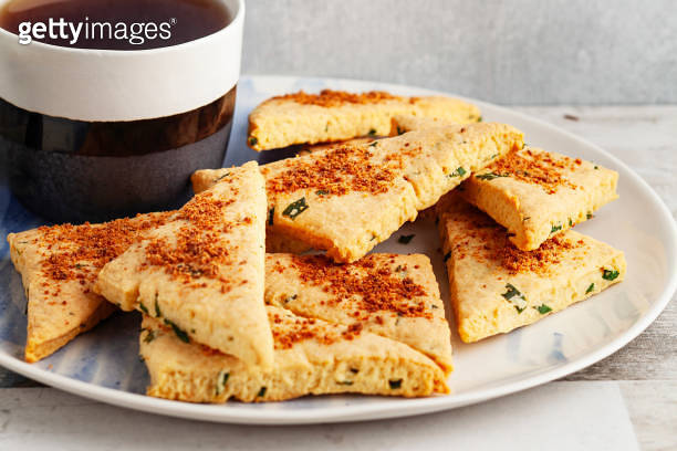 Biscuit with tea, Salty cookie. Homemade cheesy crackers with tea ...