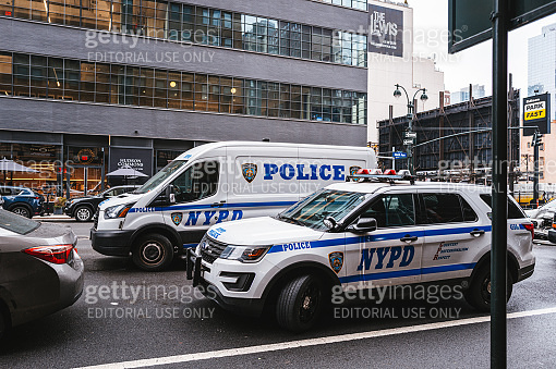 In Manhattan's bustle, an NYPD vehicles, a symbol of safety, stands ...