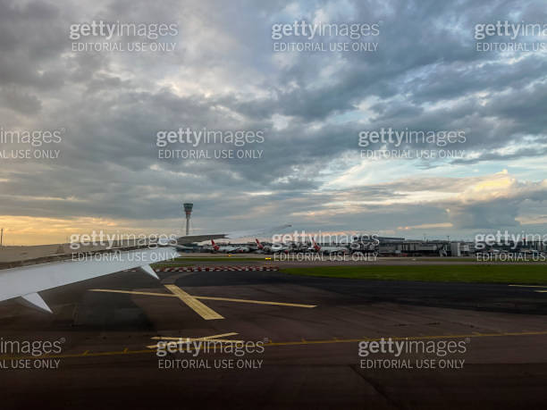 British airways airplane landing at Heathrow Airport runway, airplane ...