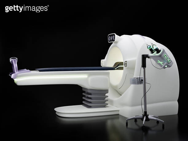 The CT scan room features a 3D rendering Modern CT scanner, used for ...
