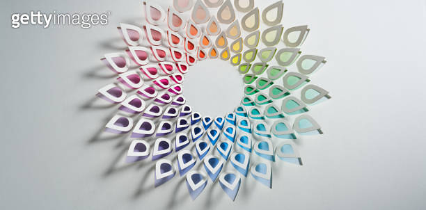 Colorful cut paper artwork in the form of an abstract floral pattern ...