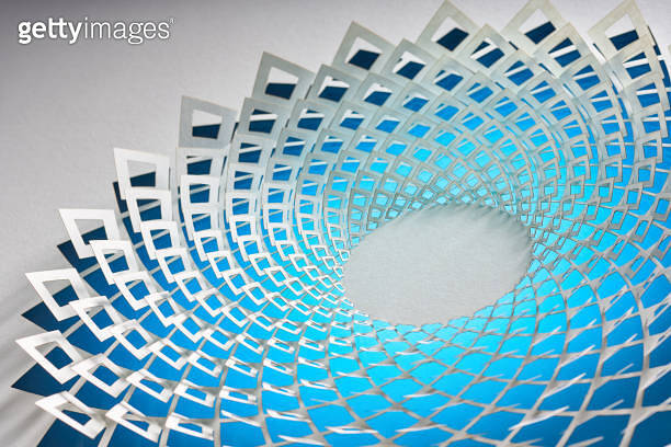 Intricate geometric cut paper art with interlocking square patterns in ...