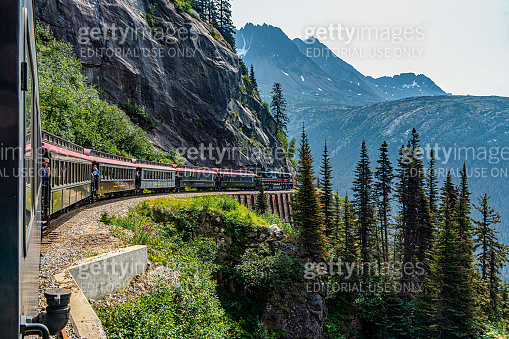 White Pass Summit excursion tour train in the mountains, Alaska, USA ...
