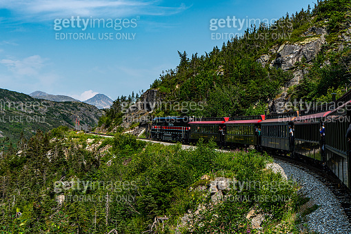 White Pass Summit excursion tour train in the mountains, Alaska, USA ...