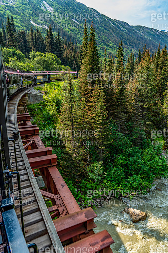 White Pass Summit excursion tour train in the mountains, Alaska, USA ...