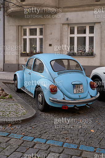 Rear view of Vintage light blue Volkswagen VW Beetle car parked on the ...