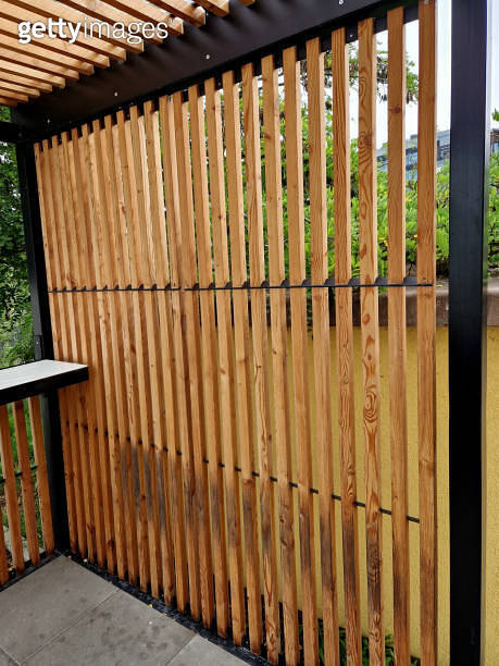 modern market stand made of metal pergola structure with slats on the ...
