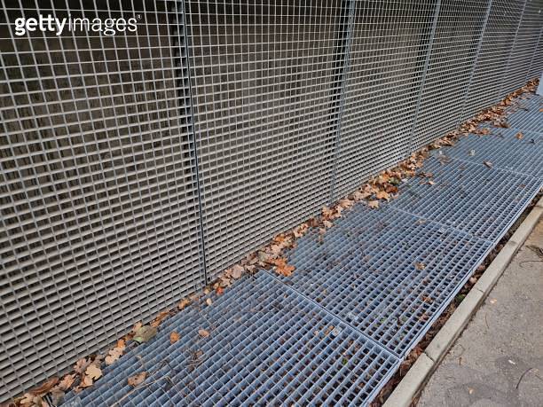 Ventilation grille along the house. basement windows are below ground ...