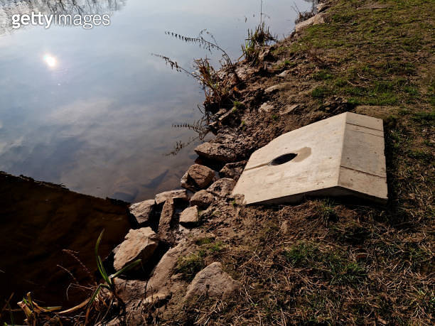 Sewer pipes under the bridge. crossing ditch by side road. concrete ...