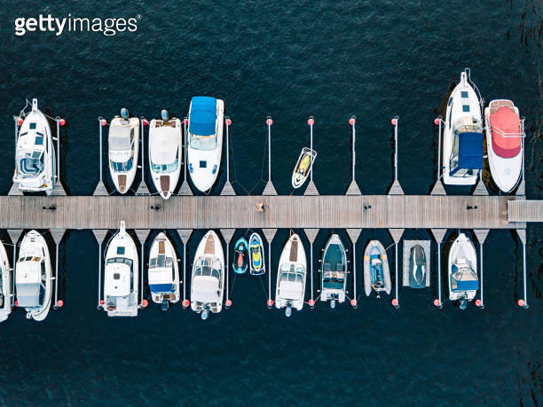 Aerial view of boats jet ski in dock in summer Finland. Colorful ...