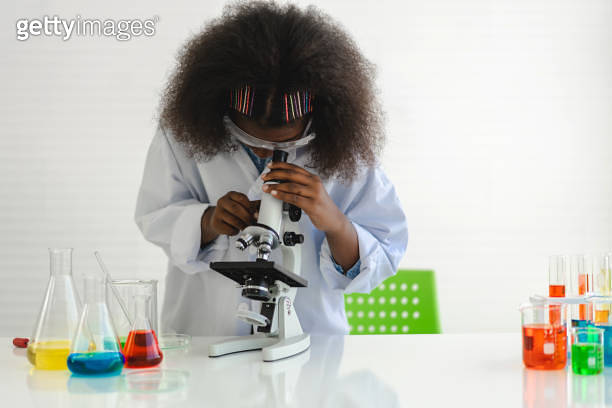 African american girl student child learning with microscope and doing ...
