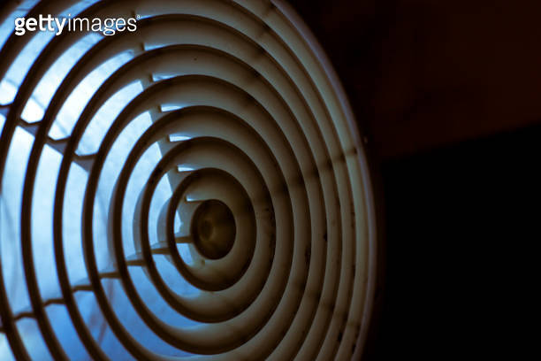ventilation grill diffuser close-up mounted in the duct at night, the ...