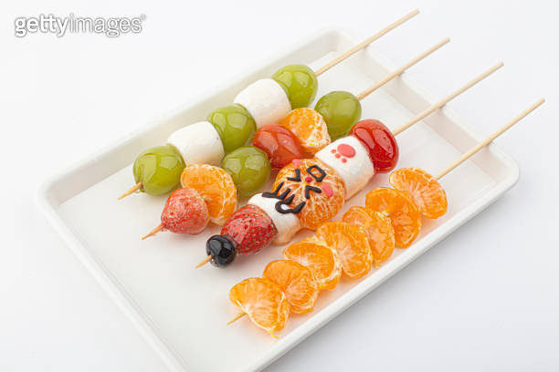 Tanghulu, a fruit skewer Korean snack candy coated with sugar syrup ...