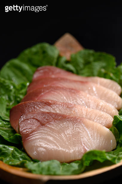 Shime Saba or raw mackerel salted and marinated in vinegar on black ...