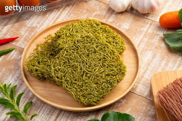 Close up Japanese style green noodles,Uncooked dry instant vegetable ...