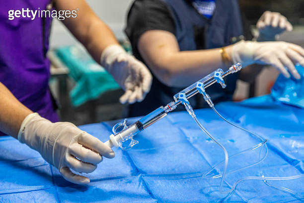 The procedure of inserting a double lumen catheter into a patient with ...