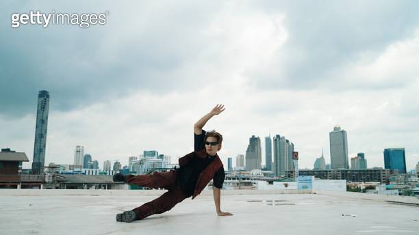 Motion shot of B-boy dance performance by professional street dancer ...