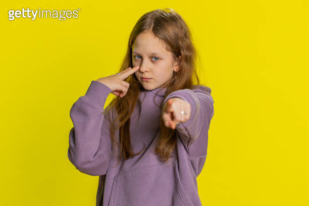 School child girl show pointing at her eyes and camera I am watching ...