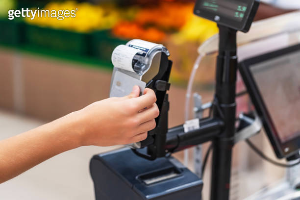 Payment by card. Process of printing invoice for a customer, credit ...