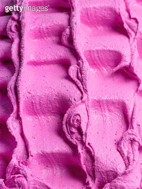Frozen Raspberry flavour gelato - full frame detail. Close up of a pink ...