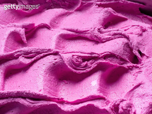 Frozen Raspberry flavour gelato - full frame detail. Close up of a pink ...